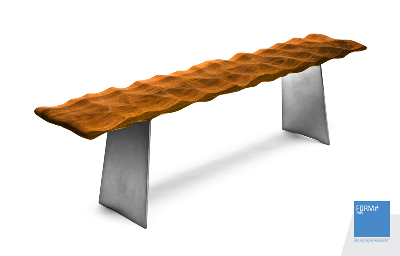 Sculptural bench made from walnut.